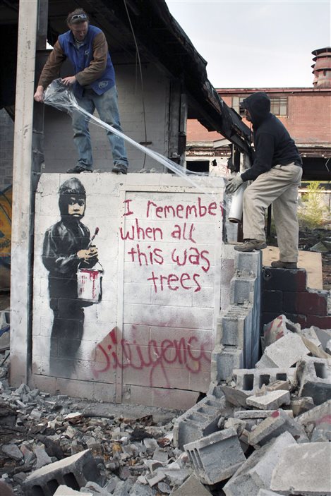 Une oeuvre de Banksy, Flower girl, à vendre aux enchères | Radio-Canada